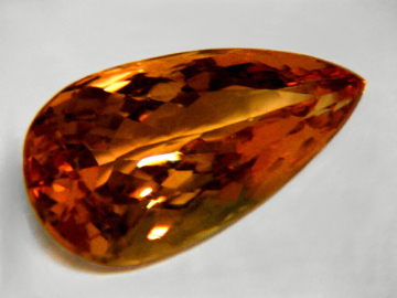 Topaz Gemstones - sky blue, colorless, and natural golden-orange-pink ...